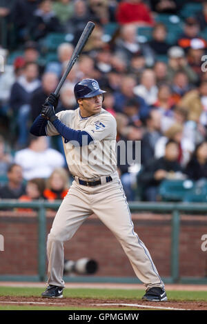 San Diego Padres' Scott Hairston is safe at third while advancing on a ...