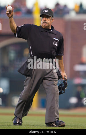 Home plate umpire Tim Tschida calls a strike for San Diego Padres Heath ...