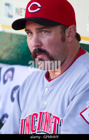 Cincinnati Reds catcher Corky Miller, back, turns to apply the tag as ...