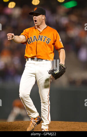 Giants pitcher Brian Wilson reacts as he closes out the 8th inning, as ...