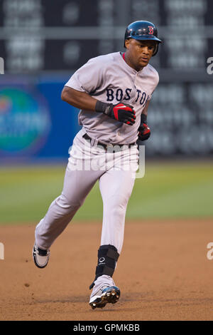 Boston Red Sox third base coach Brian Butterfield, left, fist bumps ...