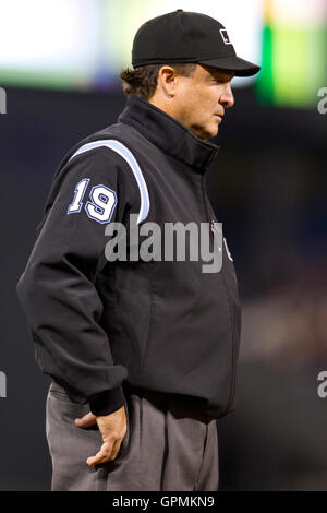 Third base umpire Ed Rapuano (R) gives home plate umpire Brian O'Nora a ...