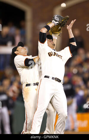 San Francisco Giants first baseman Rafael Devers, left, is checked on ...