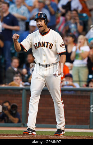Giants Pat Burrell celebrates his run scored on an Aubrey Huff single ...