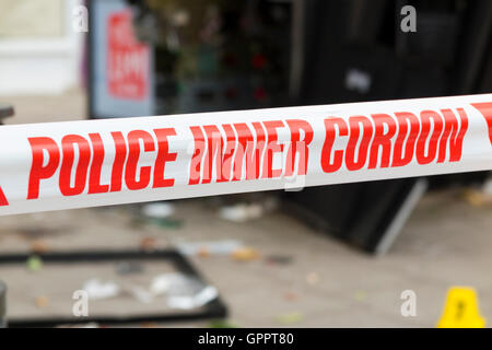 Police inner cordon tape barrier and a scene of crime officer Stock ...