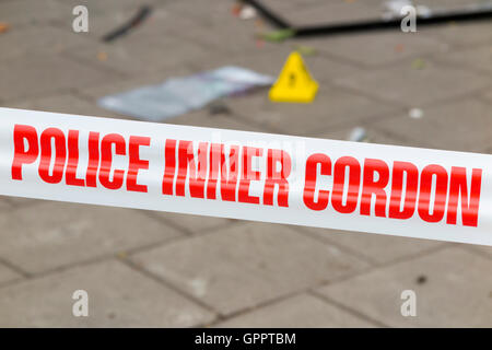 Police inner cordon tape barrier and a scene of crime officer Stock ...