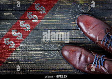 Dollar sign message and business shoes on wooden floor Stock Photo - Alamy