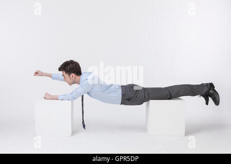 Side view of businessman lying face down Stock Photo - Alamy