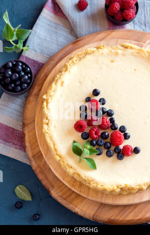 Homemade cake with fresh berries on wooden background Stock Photo - Alamy