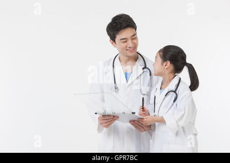 Doctor teaching his daughter medicine Stock Photo - Alamy