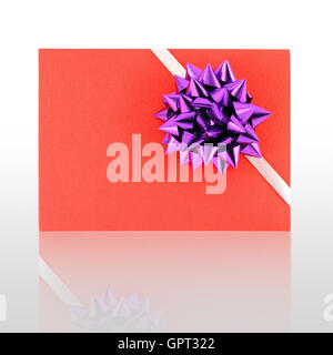 gift card with violet ribbin bow on white background Stock Photo - Alamy