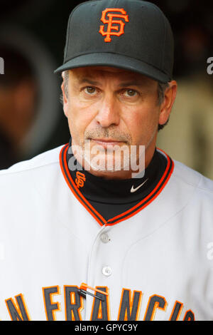 San Francisco Giants bench coach Ron Wotus, center, stands on the mound ...