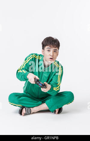 Man playing video game Stock Photo - Alamy