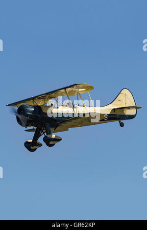 Vintage Waco UPF-7 biplane in flight againft clouds Stock Photo - Alamy