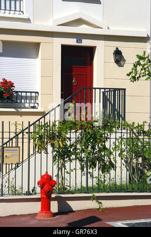 Fire hydrant at the entrance of an apartment building Stock Photo - Alamy