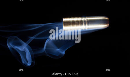Big copper bullet with smoke behind that looks like it is flying on a ...