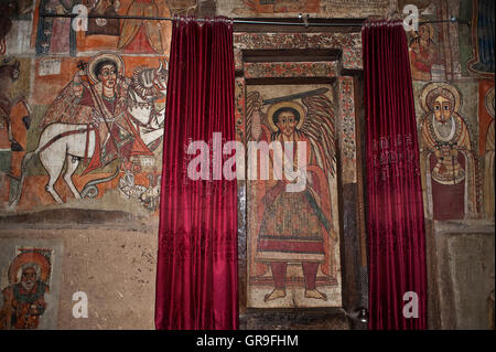 Ethiopia - Gorgora. Debre Sina Church, a priest with a cross from the ...