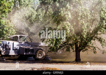 An Almond harvesting machine that shakes the almonds off of the tree ...