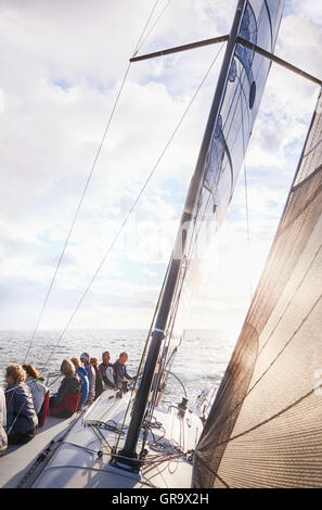 Friends sailing on sunny ocean Stock Photo - Alamy