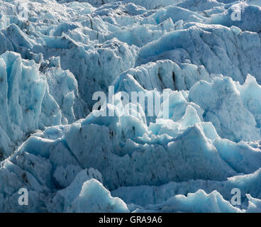 Light which passes through glacier ice comes out in various shades of ...