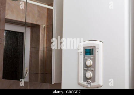 Control panel of DHW or central heating on combi boiler in restroom ...