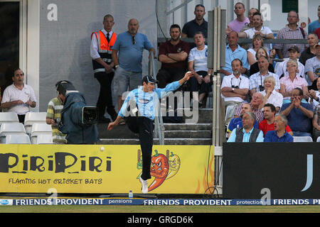 Andrew Hodd of Sussex takes a tumble while trying to take a catch and ...