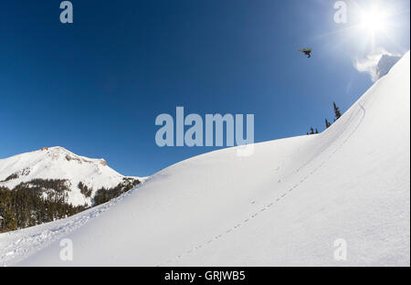 Snowboarder Hitting a Jump Stock Photo - Alamy