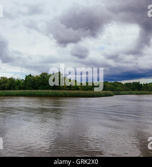 Beautiful summer day by the river, thunderclouds, Kraslava, Latgale ...