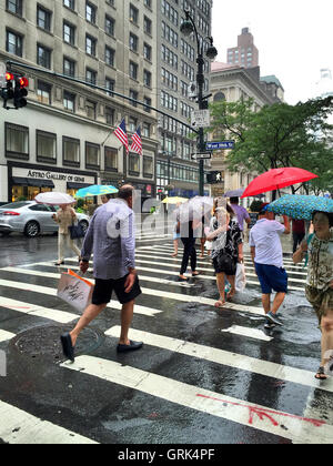 Activity under Brollies on Fifth Avenue during Rainstorm, New York City ...