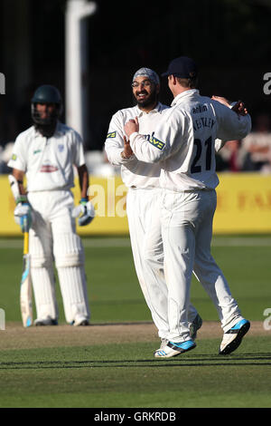 Monty Panesar of Essex celebrates taking the wicket of Anthony Ireland ...