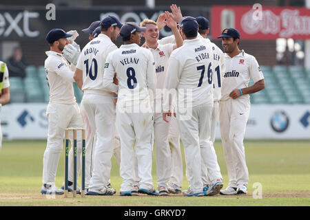 Jamie Porter of Essex celebrates with his team mates after taking the ...