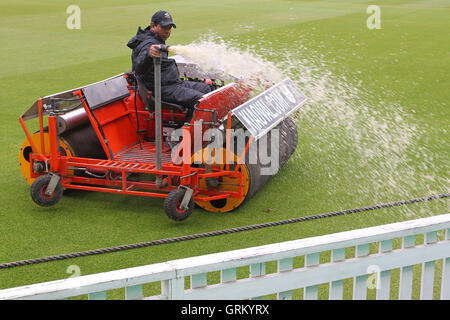 A Super Sopper is used to remove water from the outfield on Day One ...