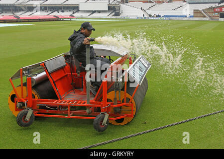 A Super Sopper is used to remove water from the outfield on Day One ...