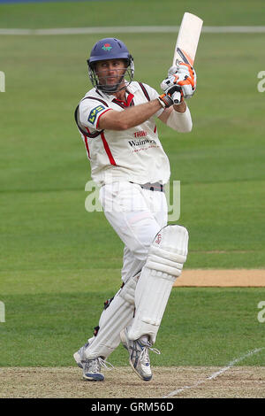 Simon Katich in batting action for Lancashire as James Foster looks on ...