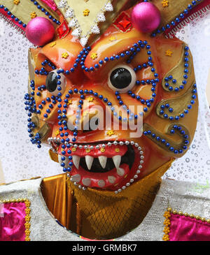 Carnival mask with beads on blue background Stock Photo - Alamy
