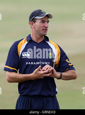 Glamorgan bowling coach Steve Watkin (L) and bowler James Harris ...