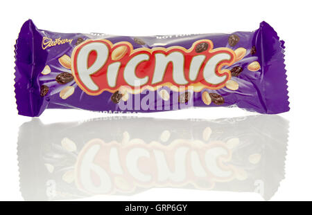 Picnic chocolate bar on white background with open cut up bar by the ...