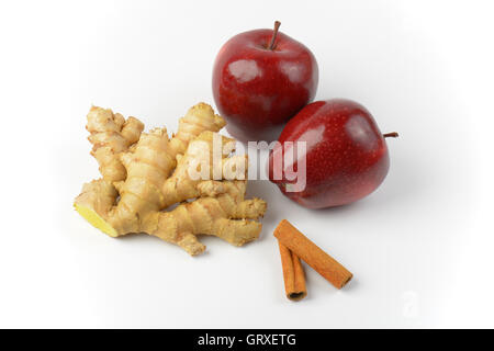 two fresh red apples, ginger root and cinnamon sticks Stock Photo - Alamy