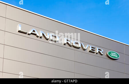 Land Rover sign. Land Rover is a car brand that specialises in four ...