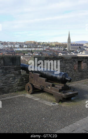 Looking along the walls of Derry to The Bogside area beyond the cannon ...