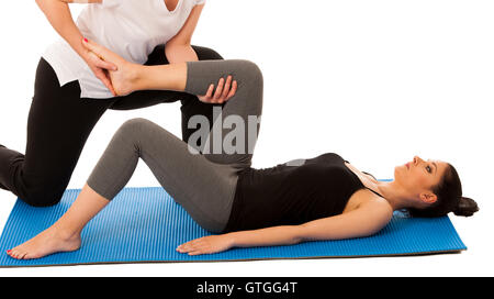 Physiotherapy - therapist doing leg stretching exercises with a patient ...