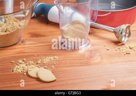 beatered cookies for making cakes on wooden table Stock Photo - Alamy