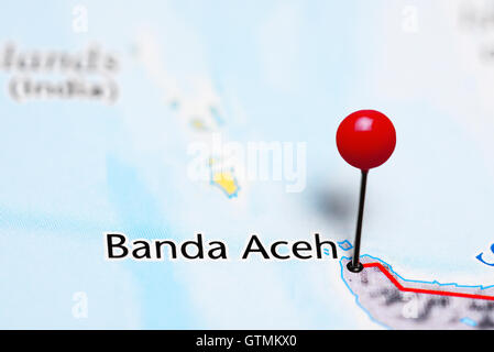 Close up to a Banda Aceh city with a red pin needle into Indonesia ...
