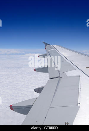 airplane wing, aeroplane wing, aircraft wing, flying over city ...