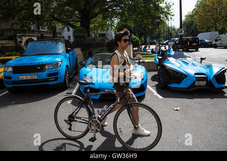 Matching blue supercars outside the Dorchester Hotel Stock Photo - Alamy
