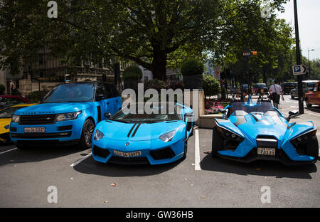 Matching blue supercars outside the Dorchester Hotel Stock Photo - Alamy
