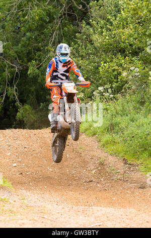 enduro rider performing a jump Stock Photo - Alamy