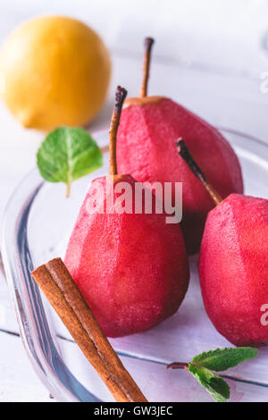 Sweet pear cooked with red wine, delicious homemade dessert Stock Photo ...