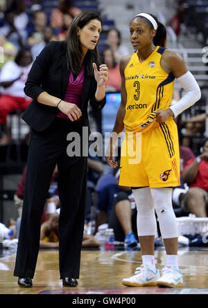 Indiana Fever head coach Stephanie White reacts during the first half of a WNBA basketball game ...