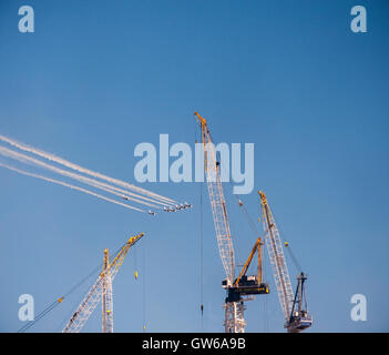 The U. S. Air Force Thunderbirds fly past the Goodyear blimp over the ...